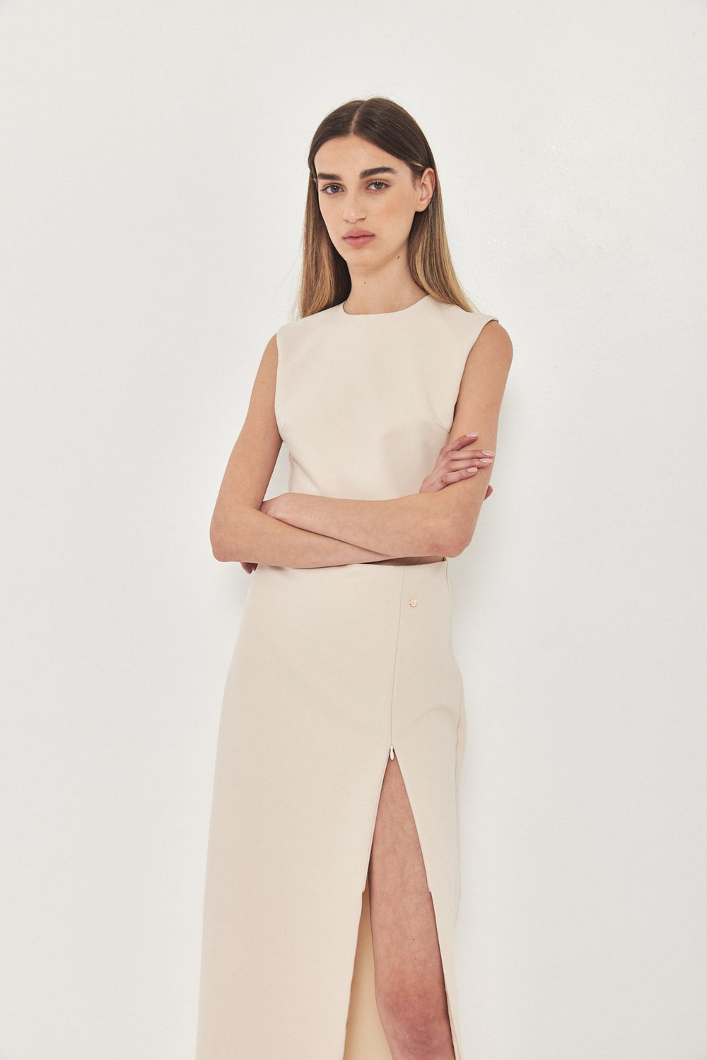 Cream colored top, back zipper and side zipper