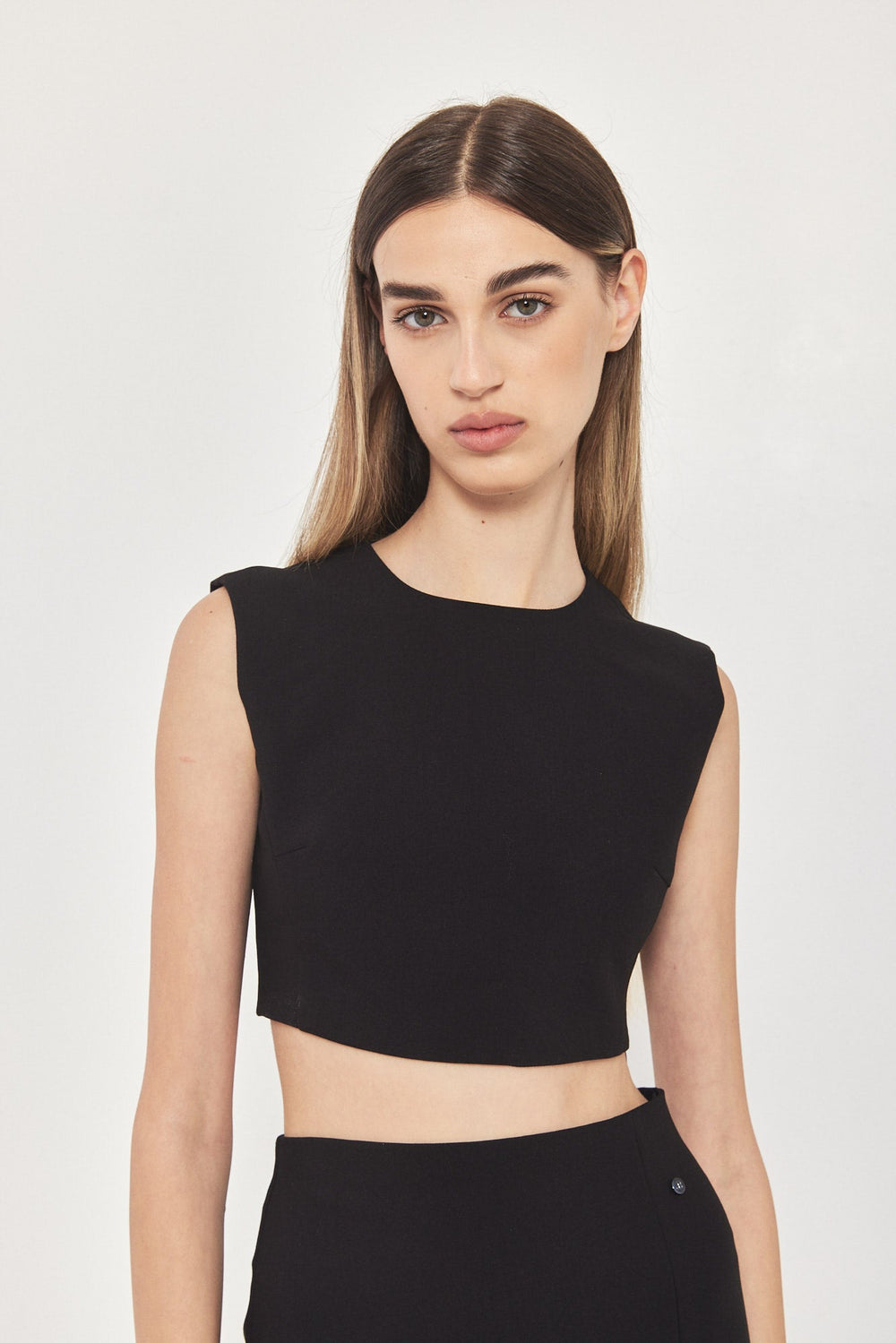 Black colored top, back zipper and side zipper