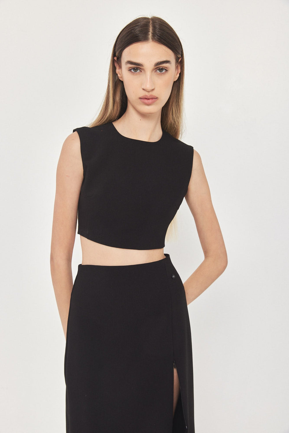 Black colored top, back zipper and side zipper